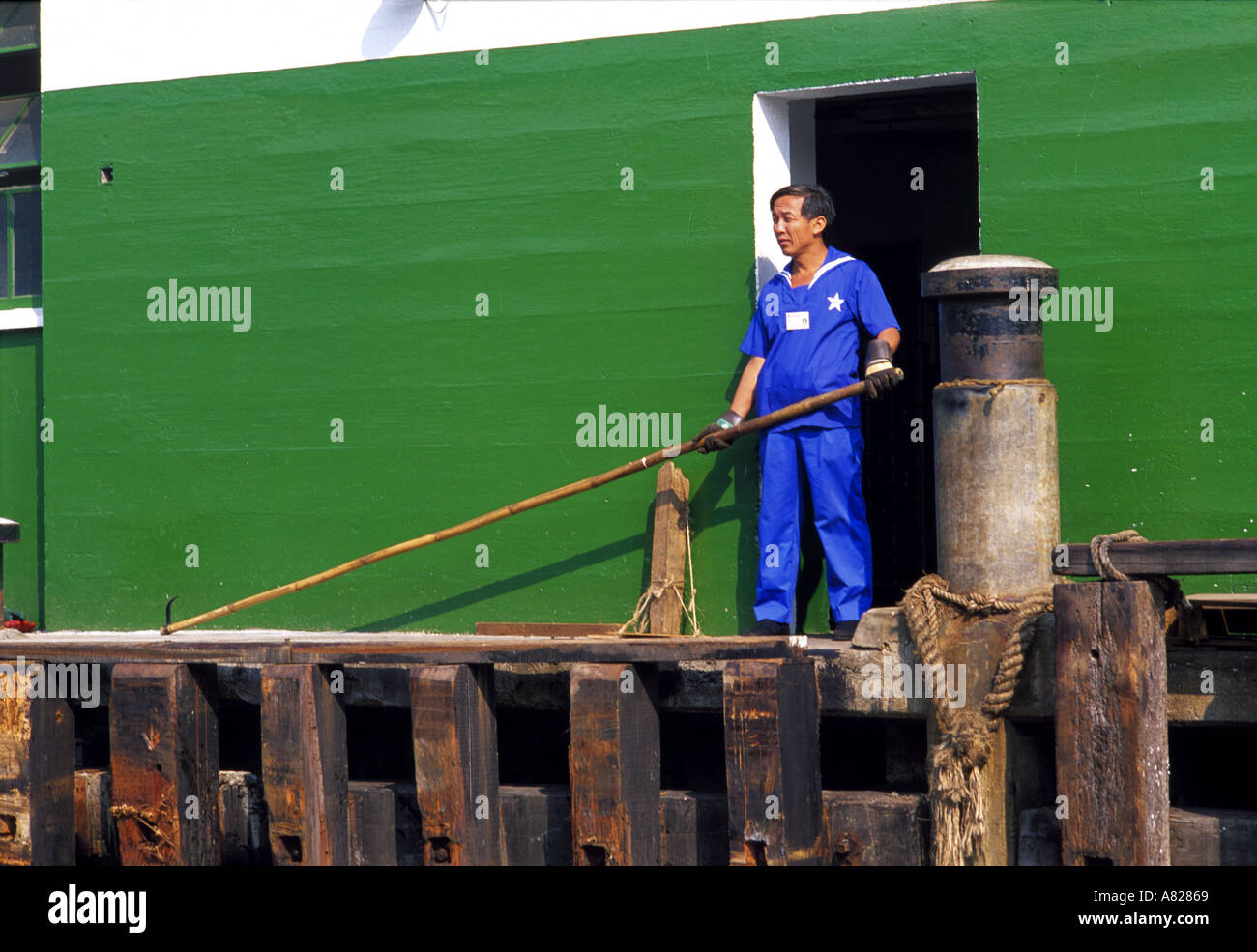 Seaman waiting for star ferry docking hong kong china lifestyle work life Stock Photo - Alamy