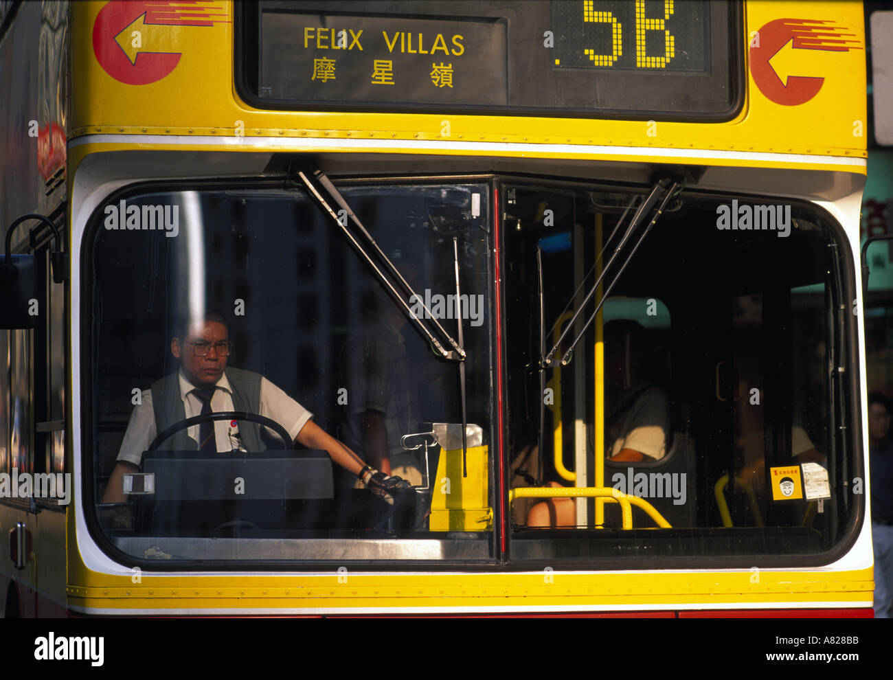 Double deck bus with driver against the sun Hong Kong china lifestyle ...