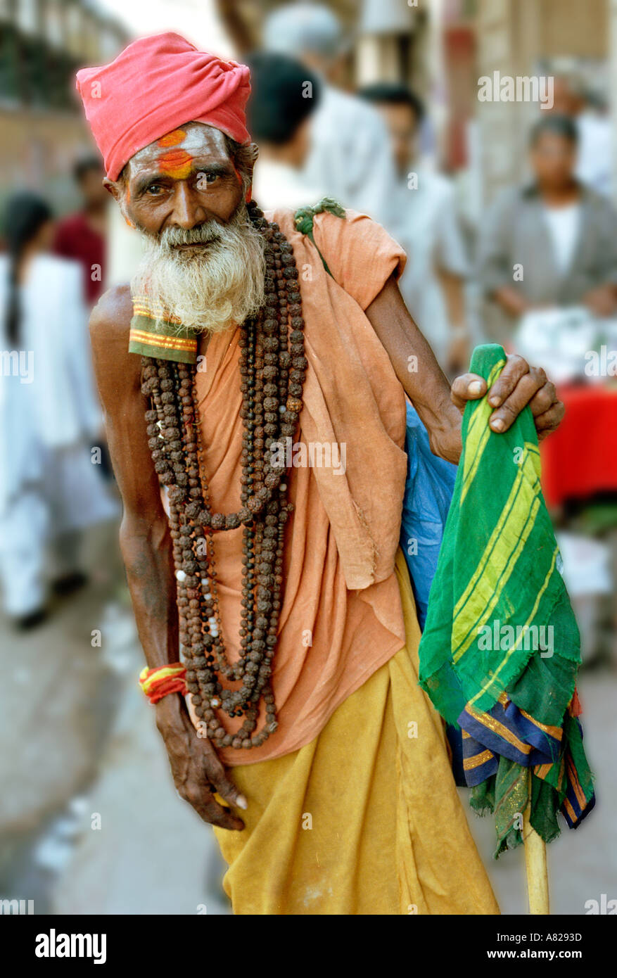 A religious hindu man walks on the street of Mumbai (Bombay) in India ...