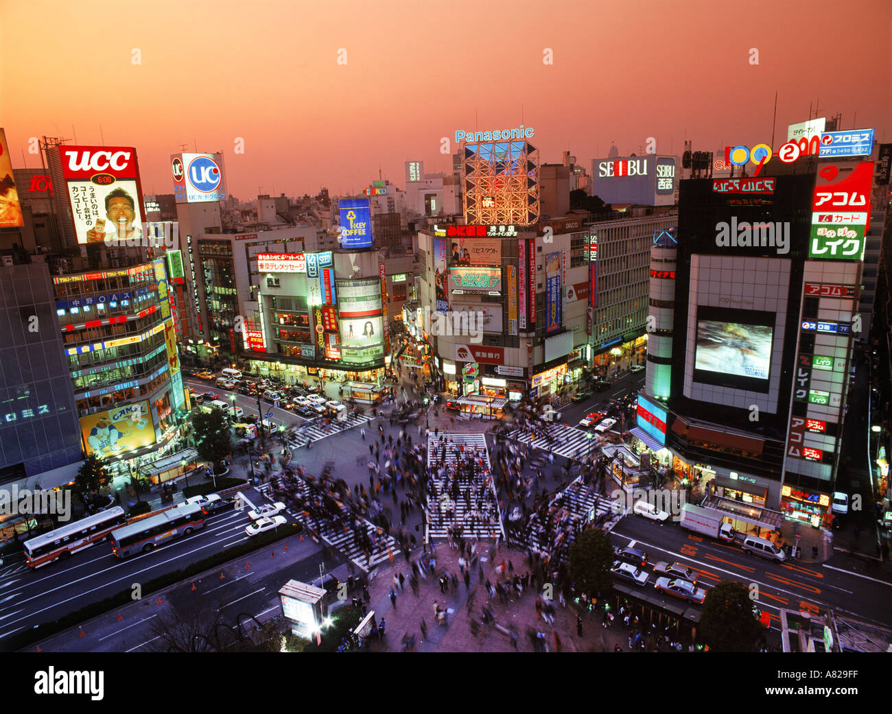 Above Shinjuku storefronts and traffic at dusk in Tokyo Stock Photo - Alamy