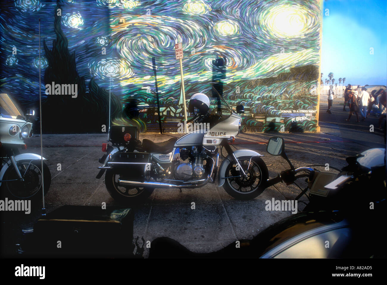 Police motorcycle on sidewalk in front of Wall Mural at Venice Beach ...