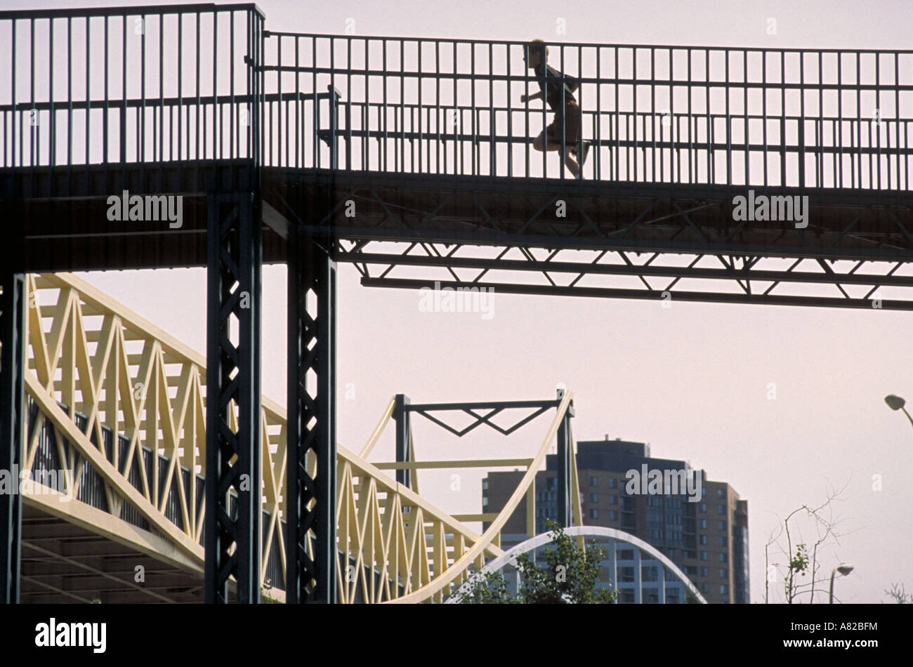Young boy running over a bridge. Minneapolis, Minnesota Stock Photo - Alamy