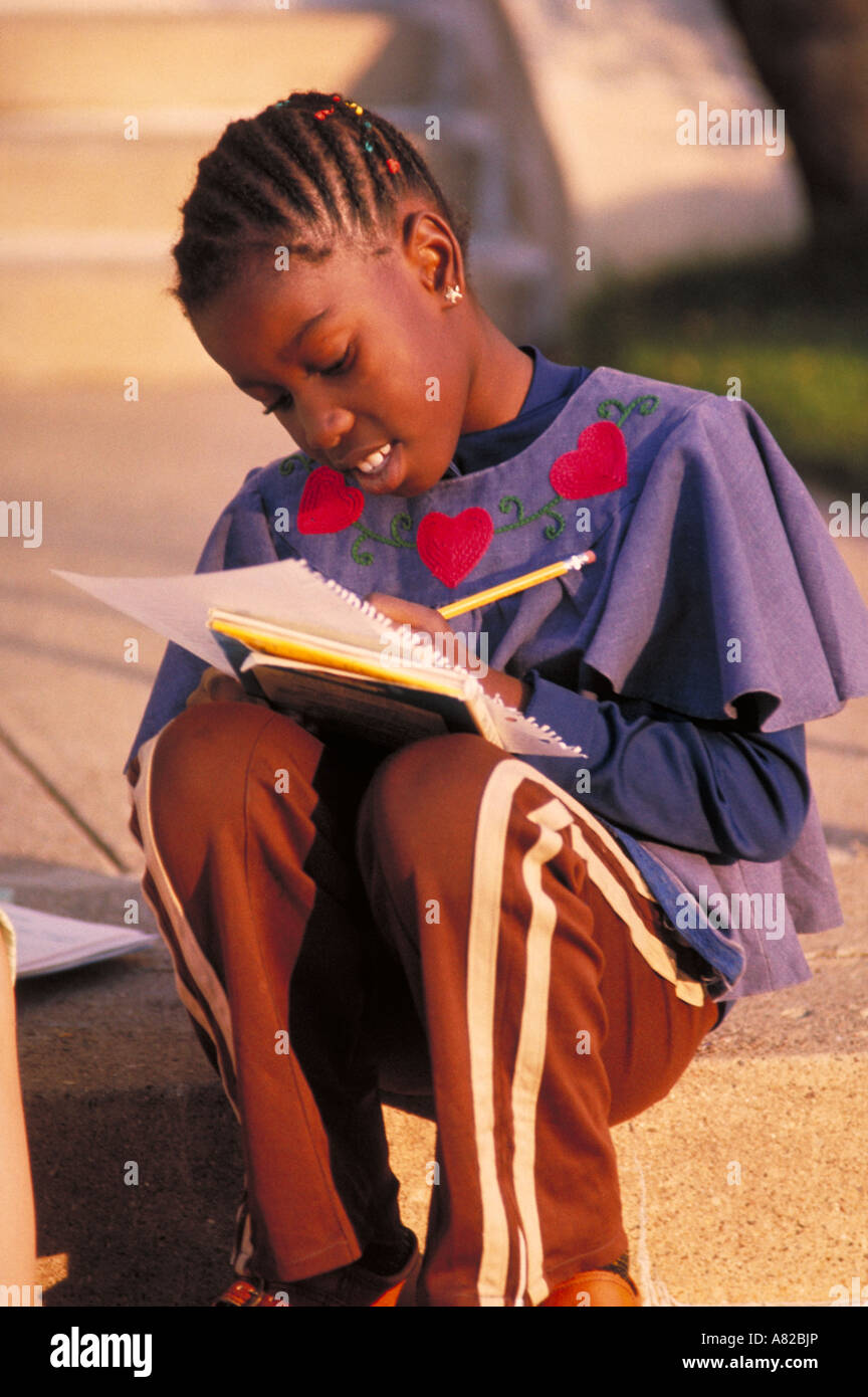 Young black girl doing homework outside. St. Paul, Minnesota Stock ...