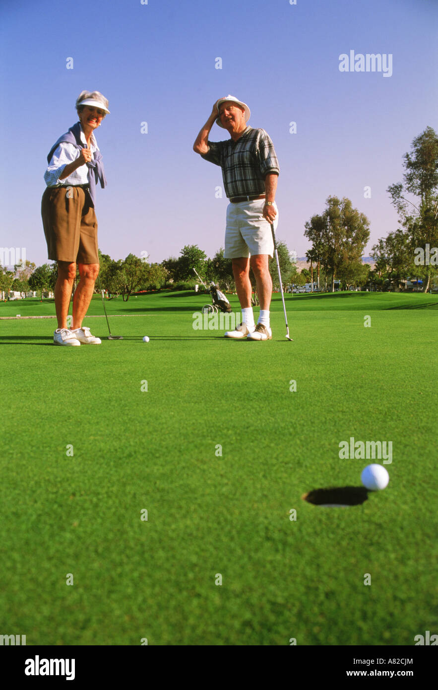 Elderly couple playing golf hi-res stock photography and images - Alamy