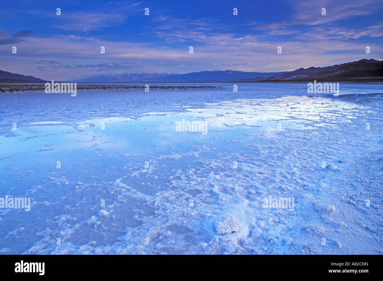Flooded salt pan under the Funeral Mountains at dawn Death Valley ...