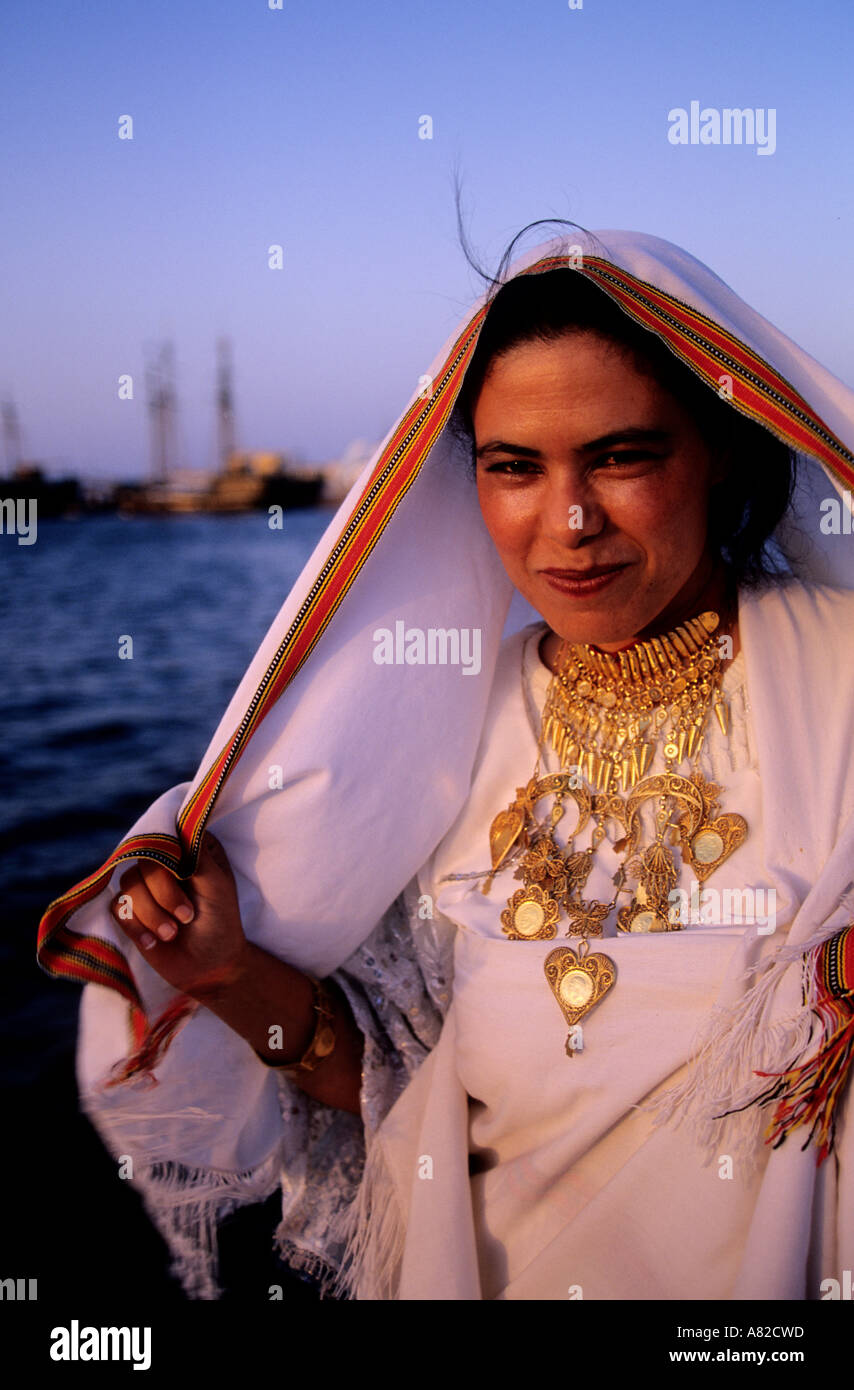 Tunisia, Djerba, Houmt Souk, young lady in traditional garments Stock ...
