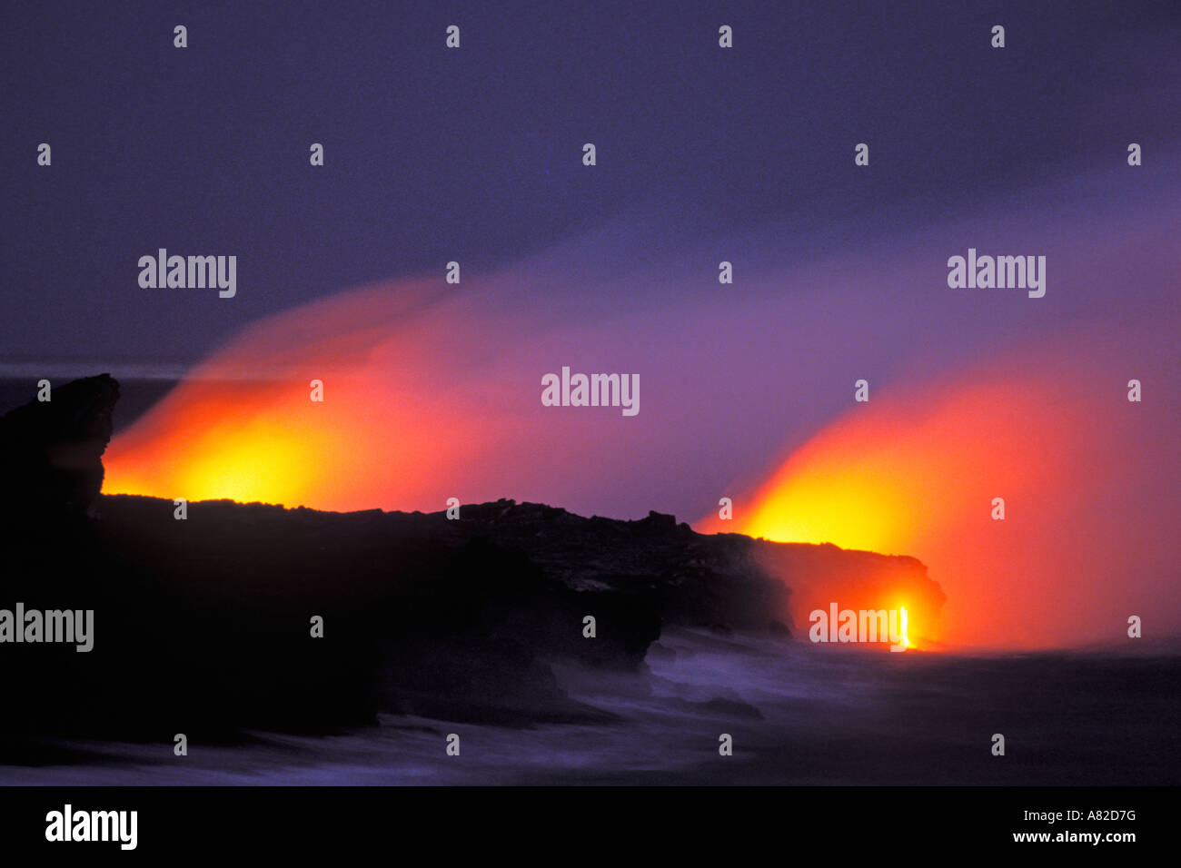 Lava flow entering the Pacific Ocean at dusk Hawaii Volcanoes National Park The Big Island ...
