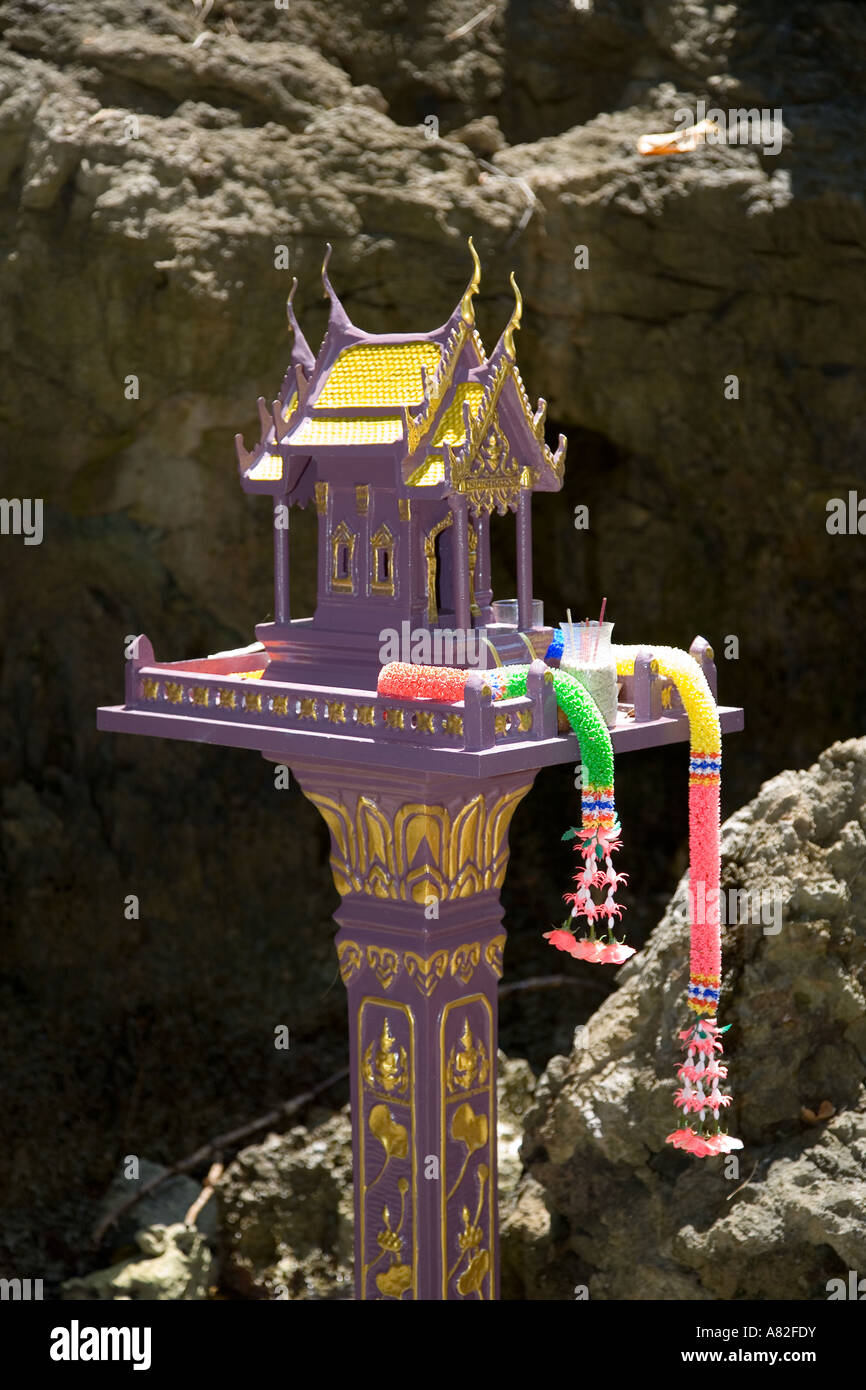 Thai spirit house (San Phra Phum), shrine with garlands, ornate spirit ...