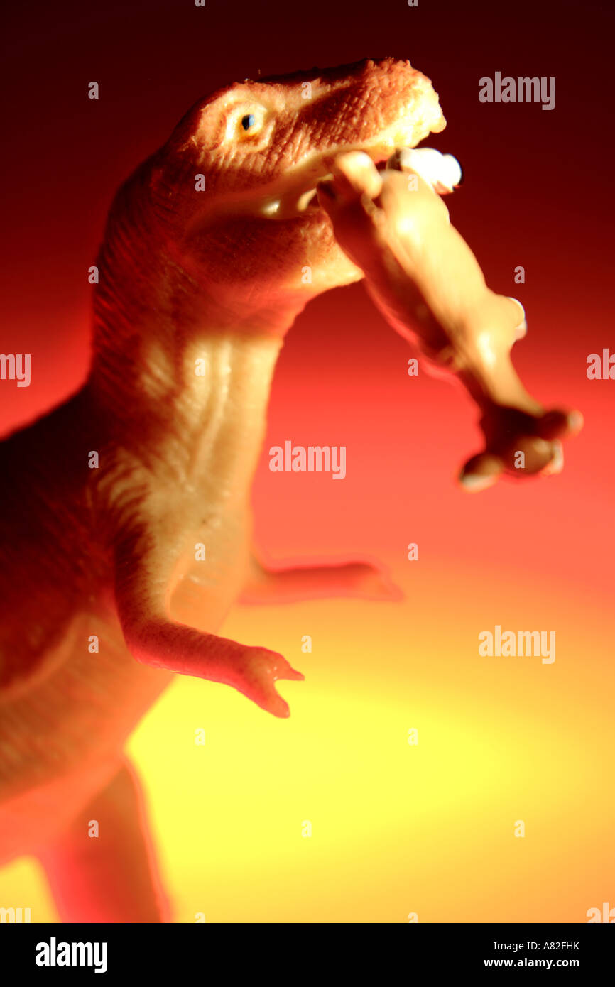 Dinosaur holding catch in mouth Stock Photo - Alamy