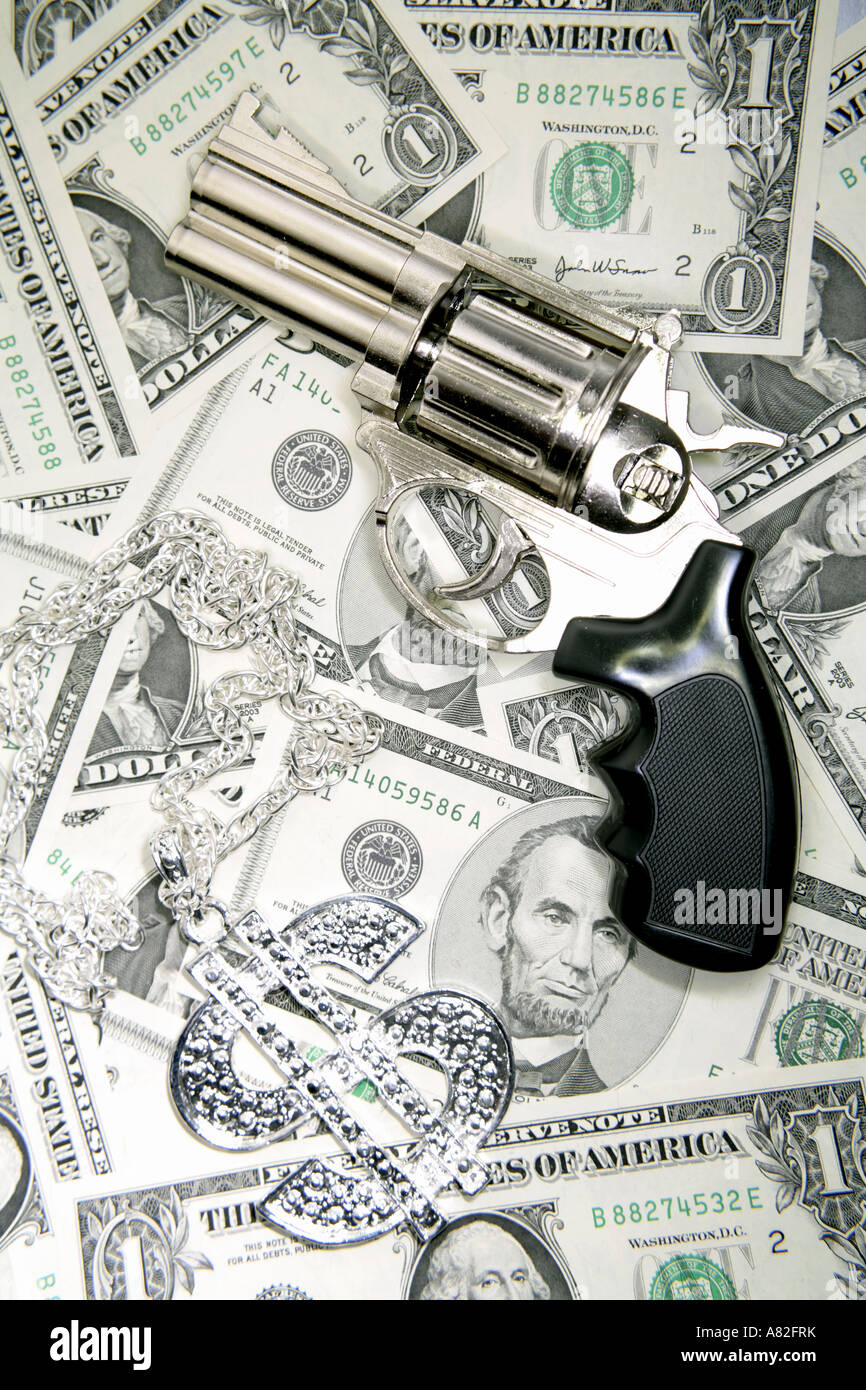 Gun and dollar symbol on U.S. currency Stock Photo - Alamy