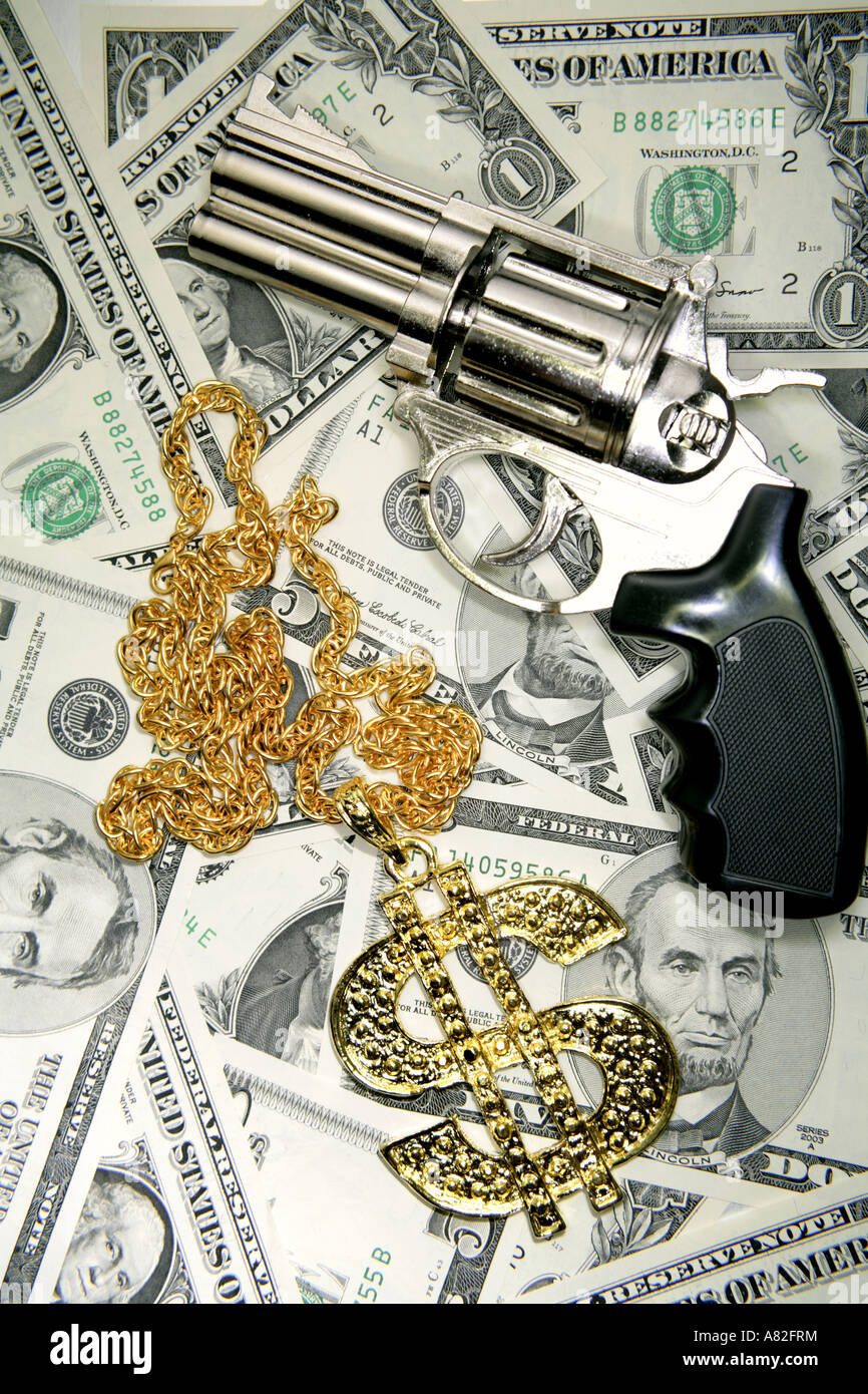 Gun and dollar symbol on U.S. currency Stock Photo - Alamy