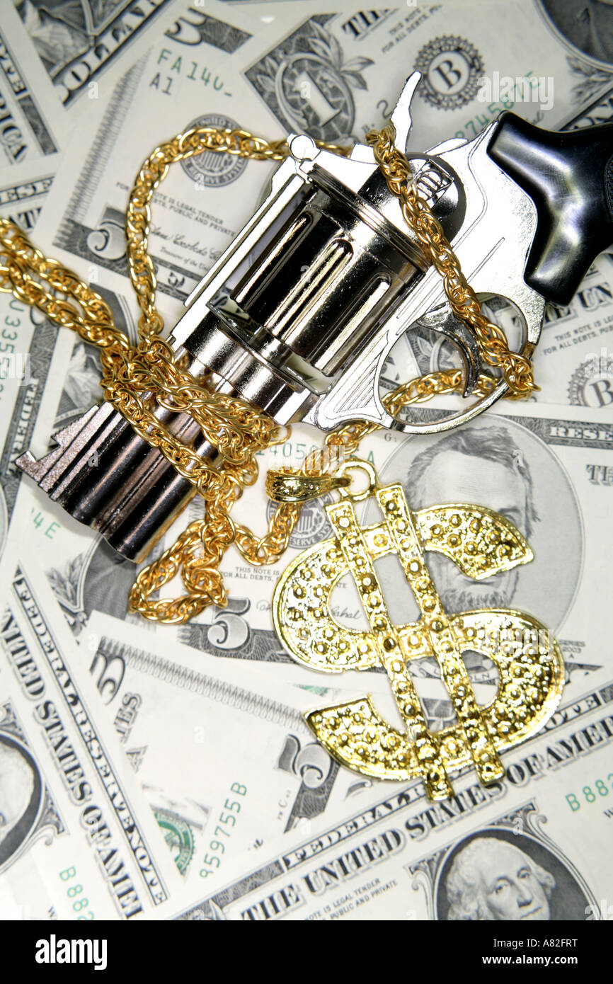 Gun and dollar symbol on U.S. currency Stock Photo - Alamy