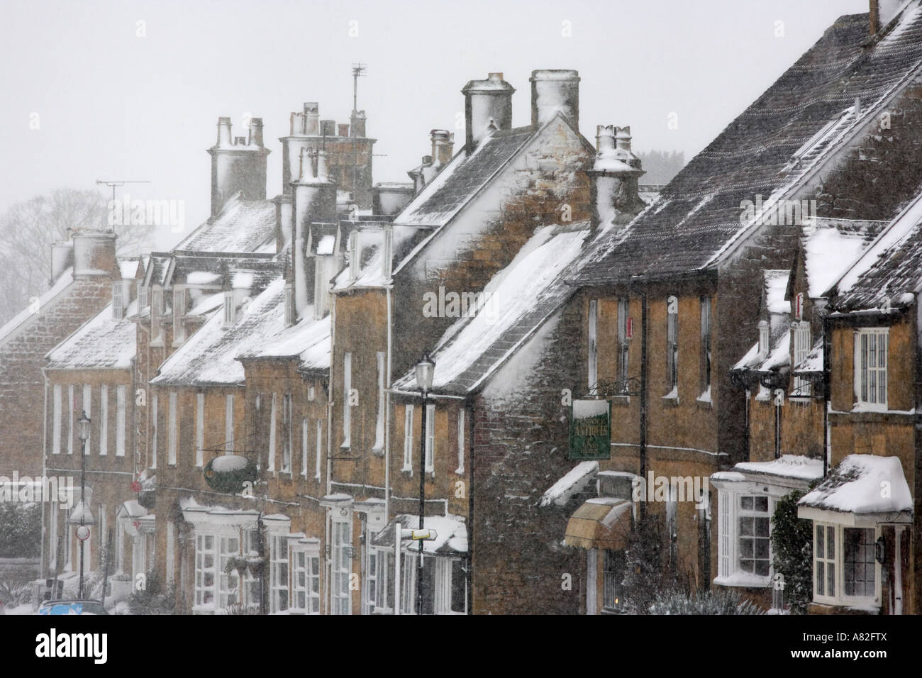 Snow on roof tops in the village of Broadway in Worcestershire UK Stock ...