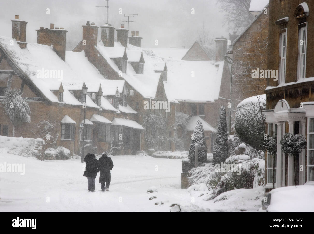 Uk people walking in snow storm blizzard hi-res stock photography and ...