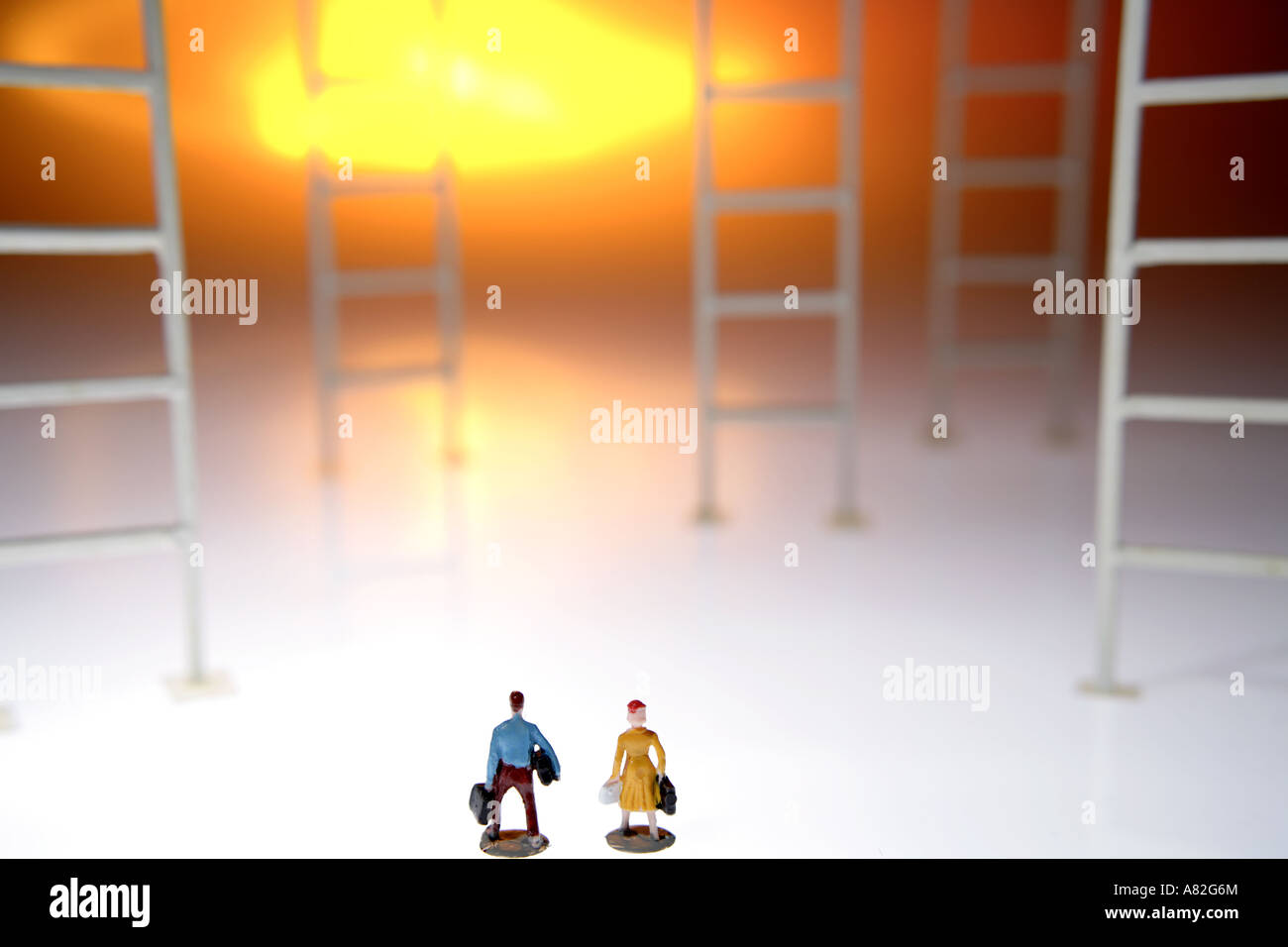 Two people in front of ladders Stock Photo - Alamy