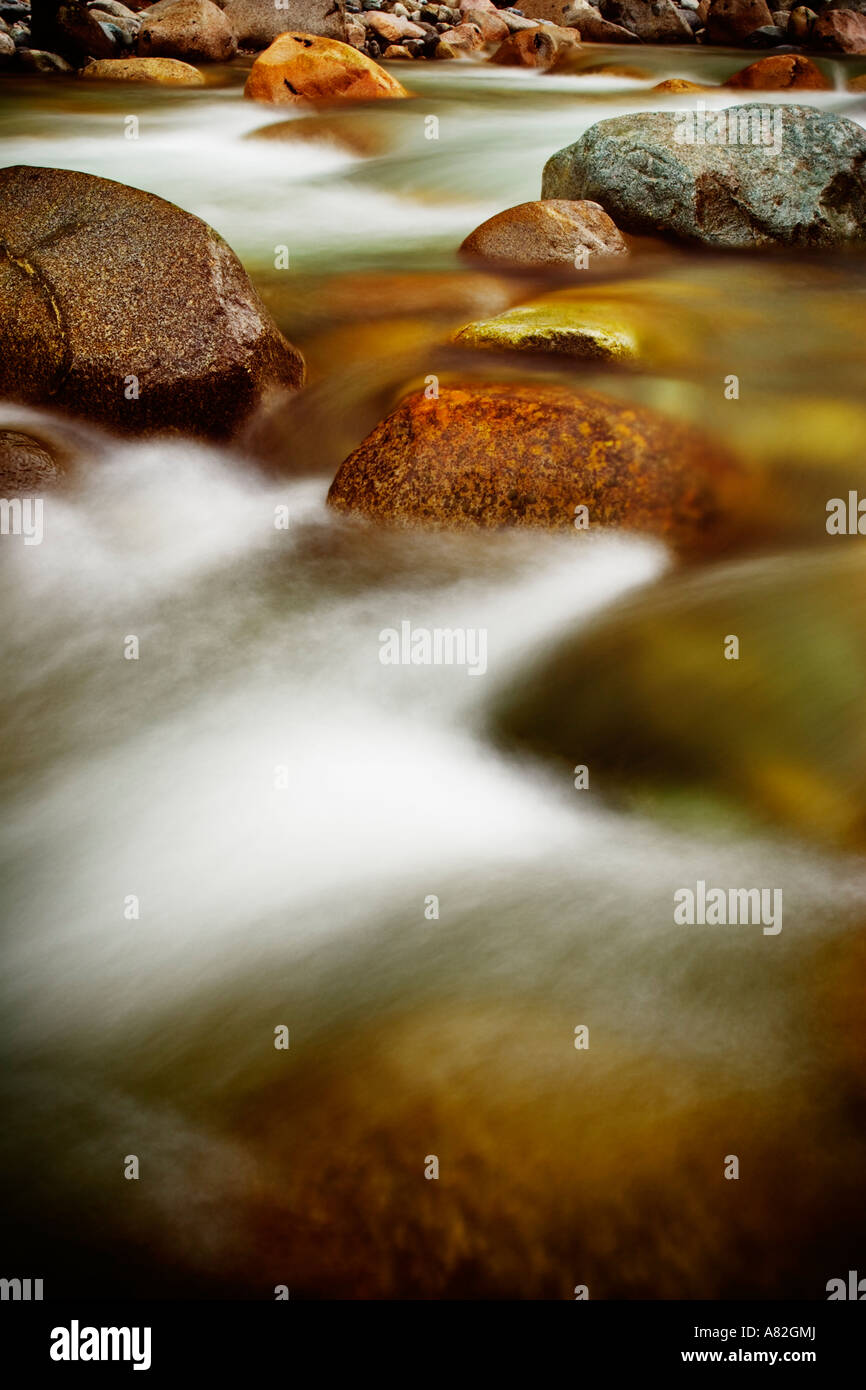 water flowing over rocks in a river Stock Photo - Alamy