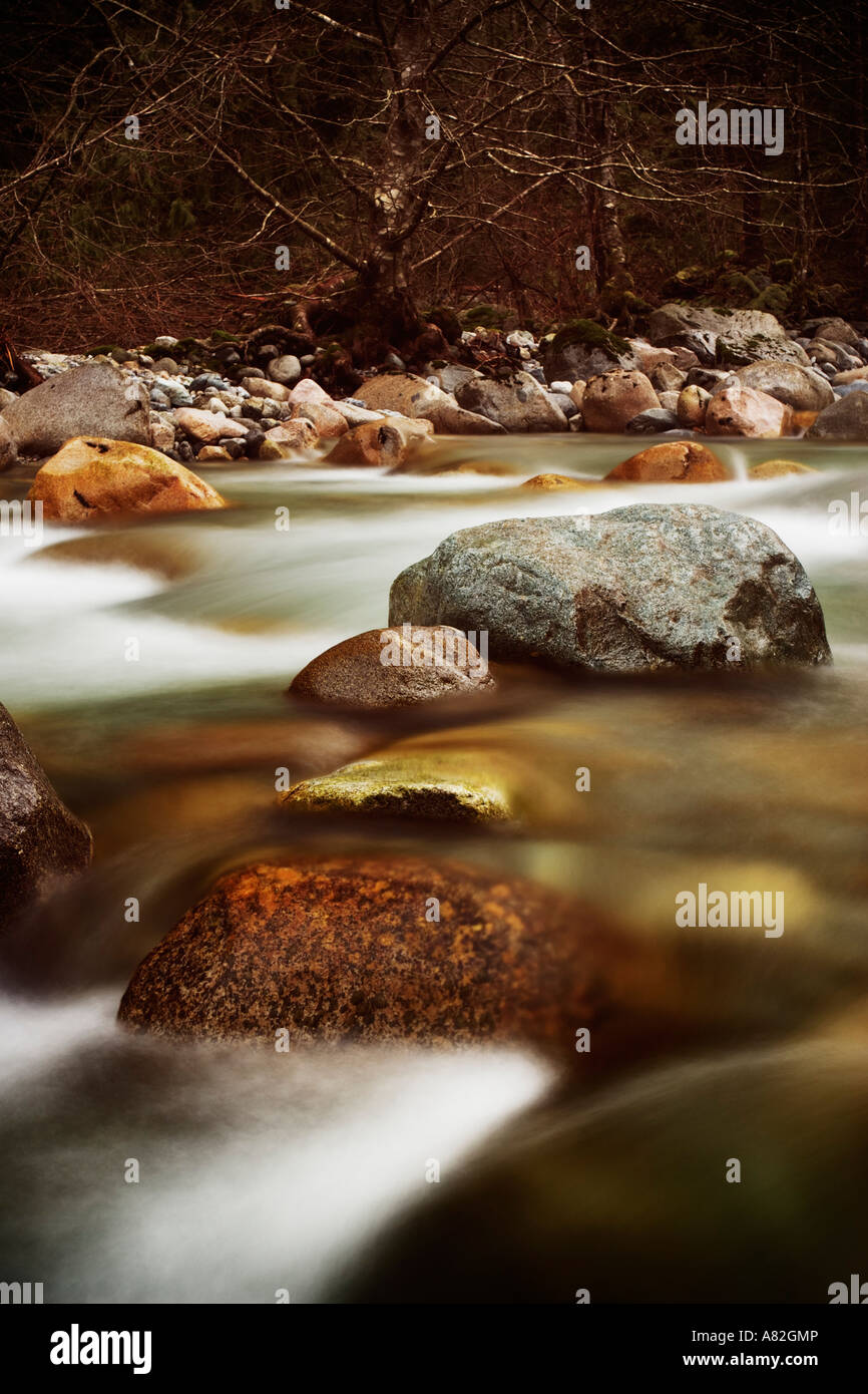 water flowing over rocks in a river Stock Photo - Alamy