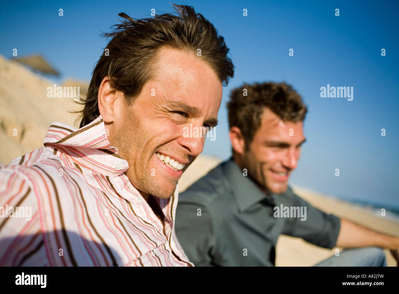 Two men at the beach Stock Photo - Alamy