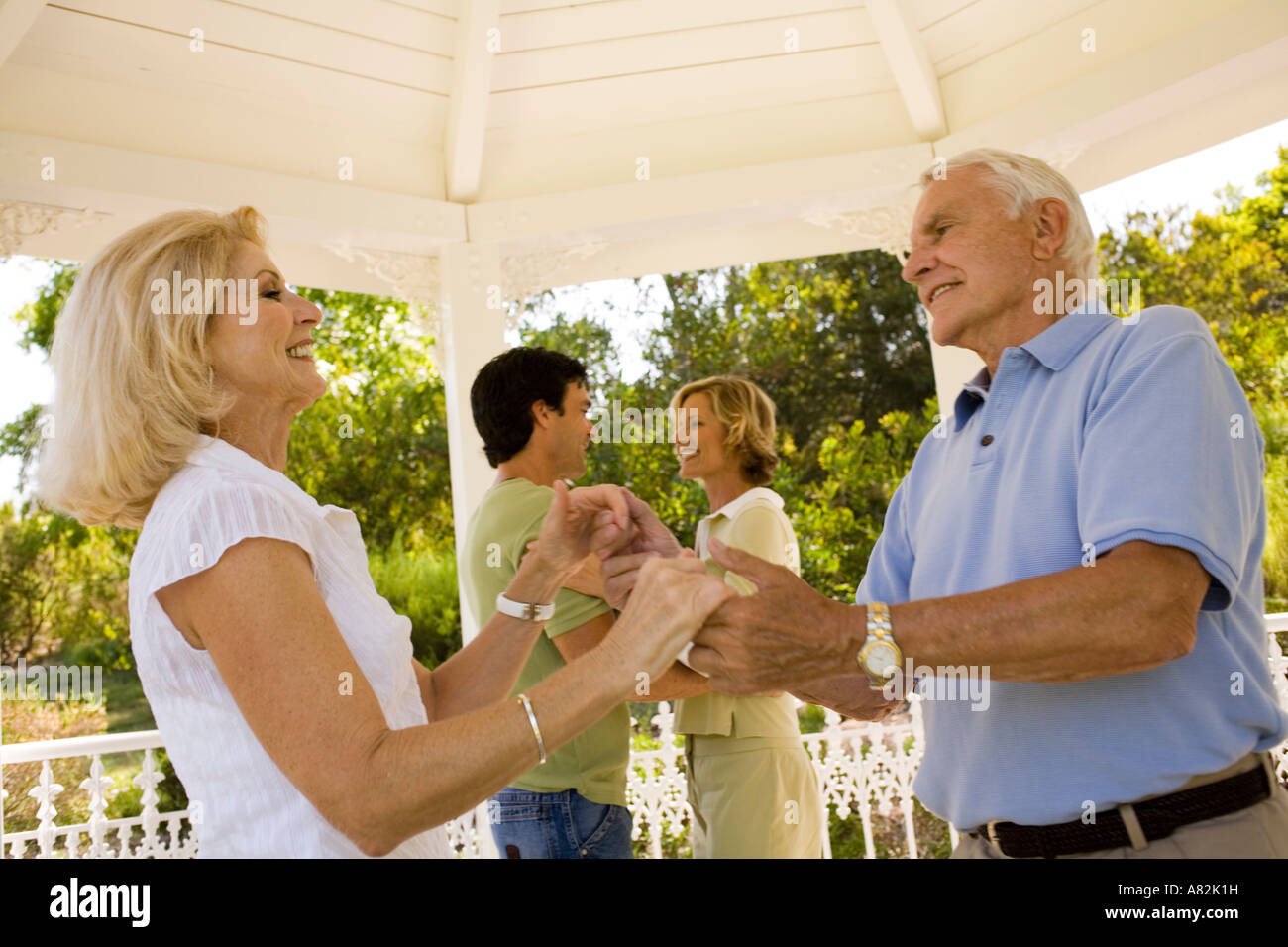 Two couples in a gazebo dancing Stock Photo - Alamy