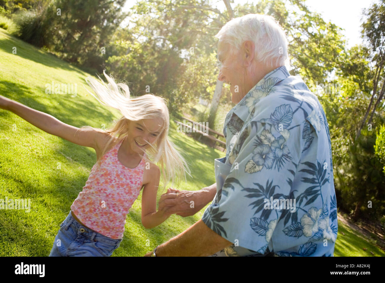 Grandfather and granddaughter dancing hi-res stock photography and ...