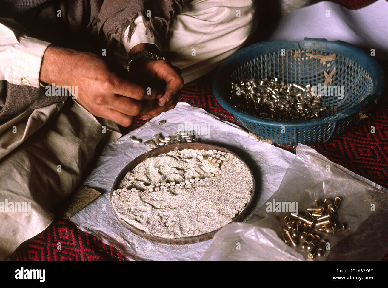 Pakistan NWFP Darra Adam Khel hands of man making pistol bullets Stock ...