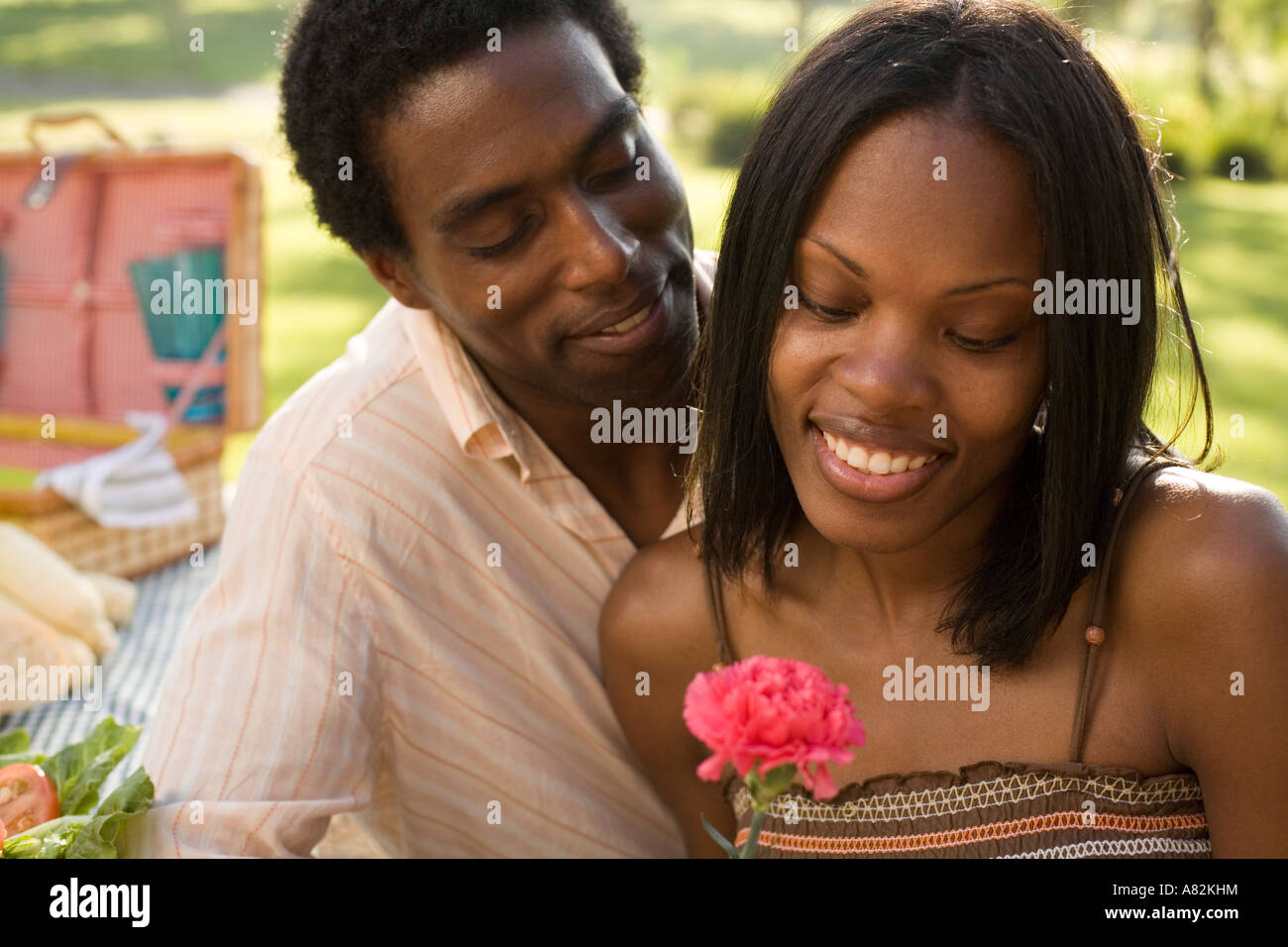 A couple having a picnic Stock Photo - Alamy