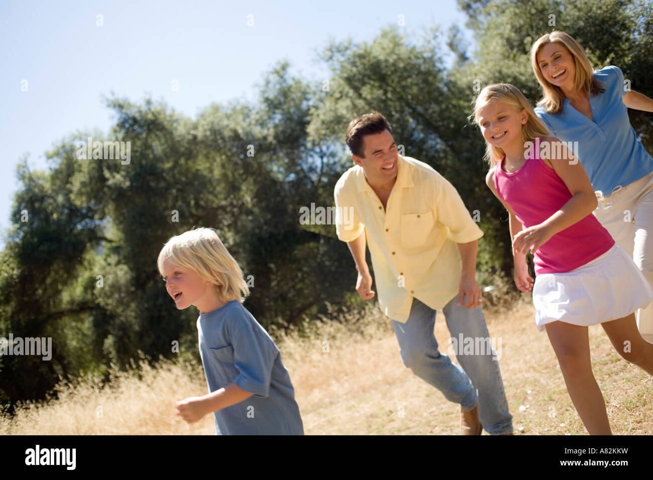 A family running at a park Stock Photo - Alamy