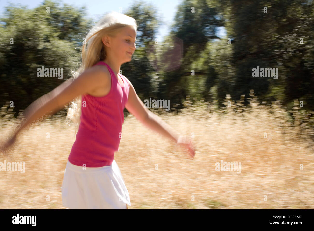A girl walking in a park Stock Photo - Alamy
