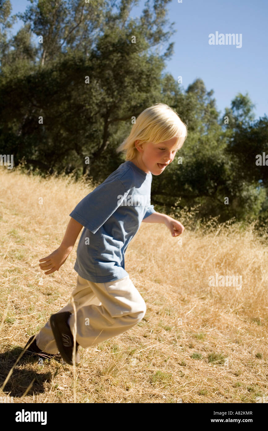 A boy running in a park Stock Photo - Alamy