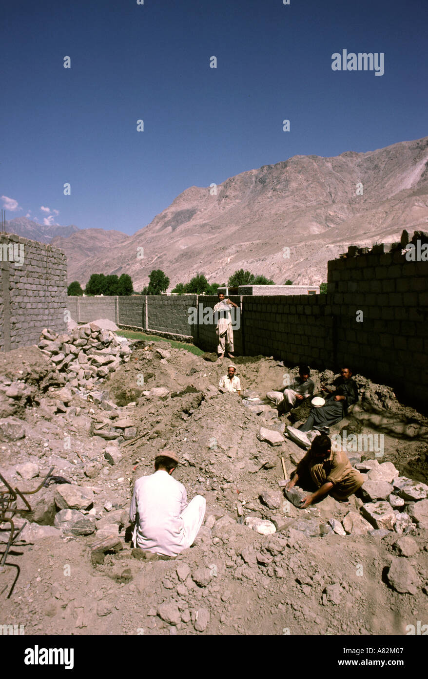 Pakistan Azad Kashmir Gilgit construction site men digging foundations ...