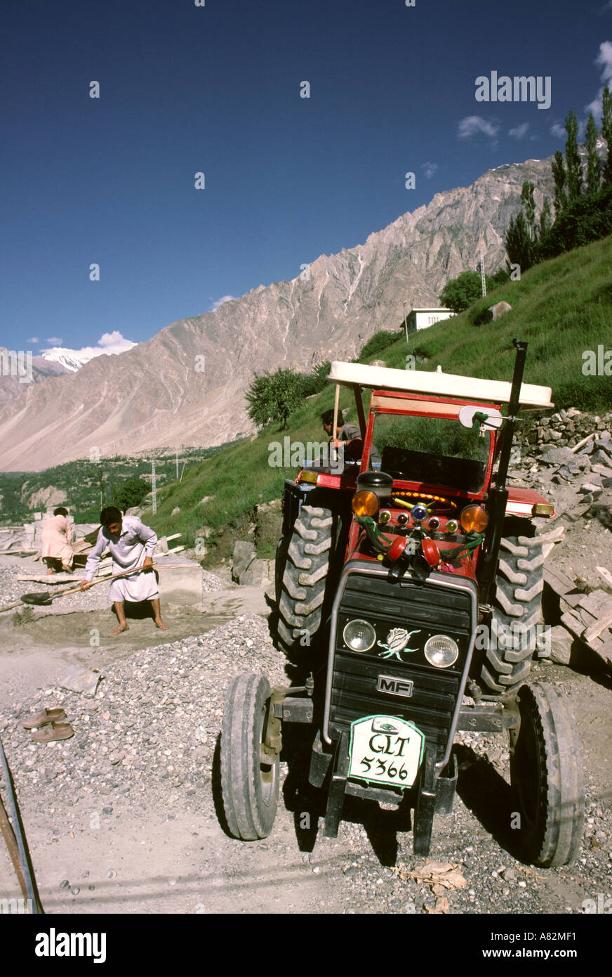 Pakistan Hunza Valley Karimabad construction builders at work with ...