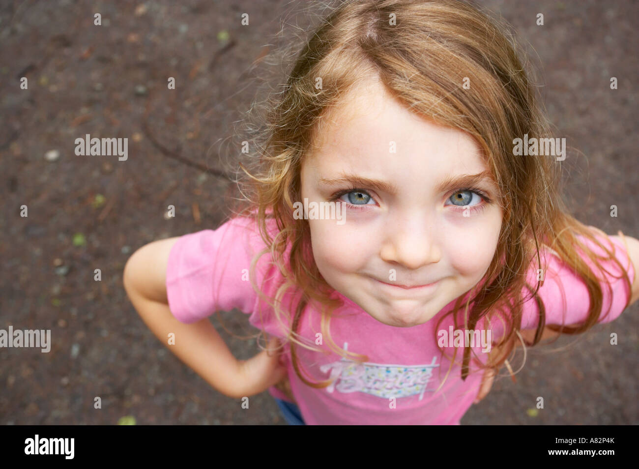 A cheeky little girl Stock Photo - Alamy