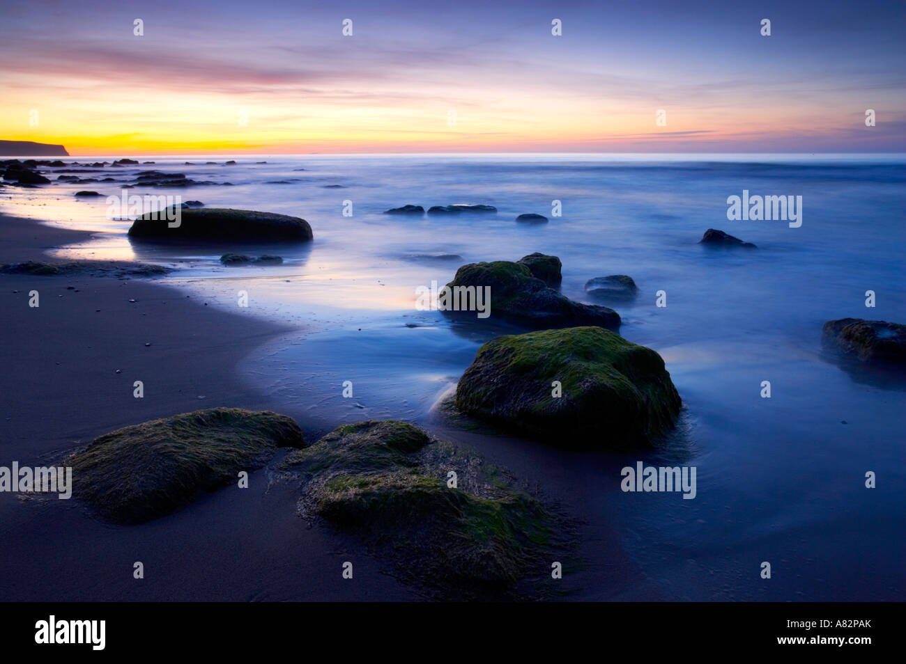 Whitby beach at sunset looking towards Sandsend on the North Yorkshire ...