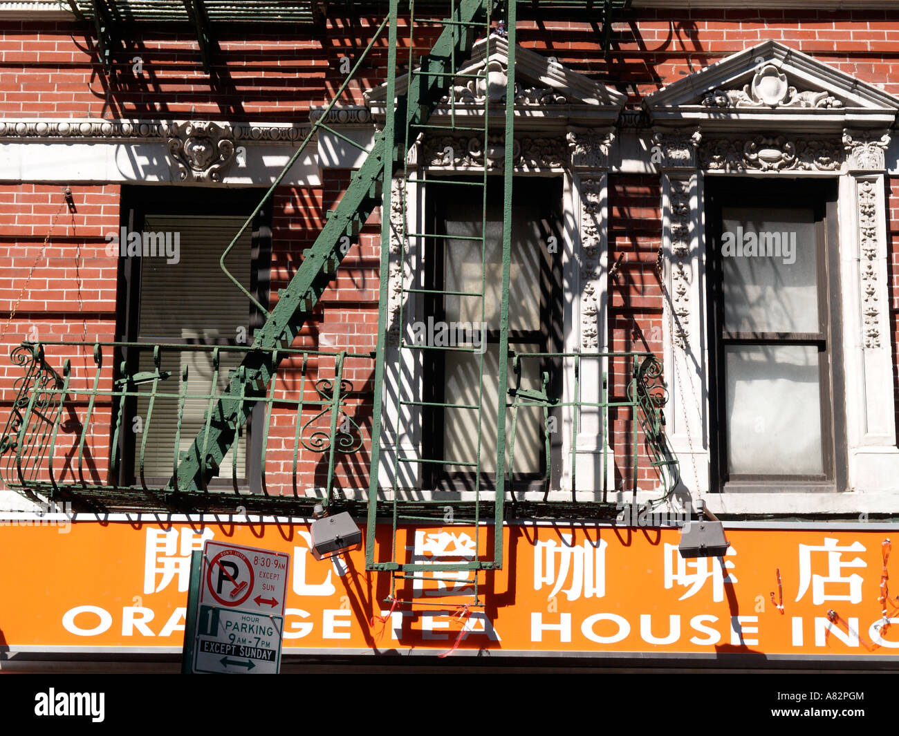 fire escape and chinese shop signs in Chinatown New York Stock Photo ...