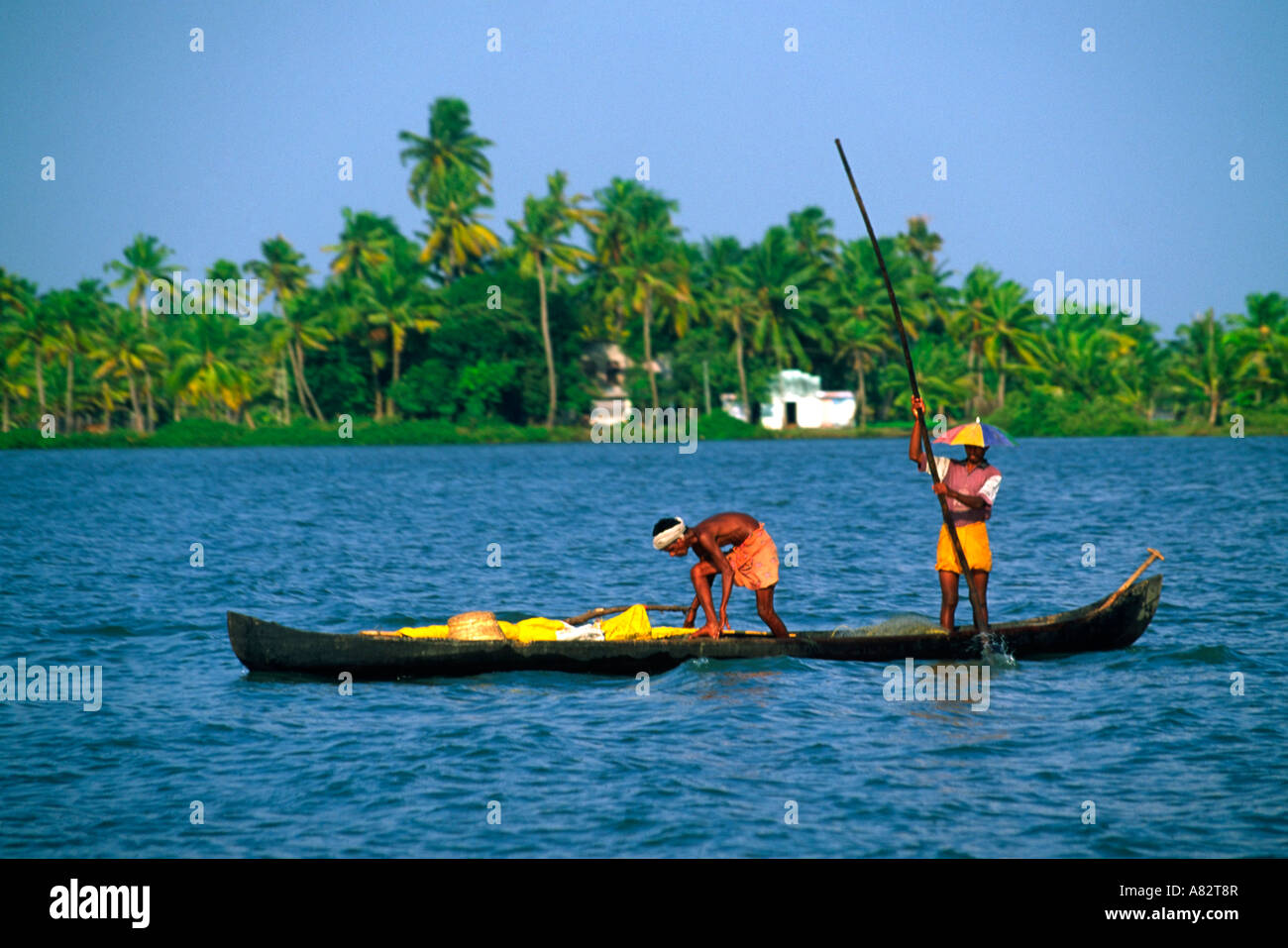 India Kerala indian on a small boat in backwaters Stock Photo - Alamy
