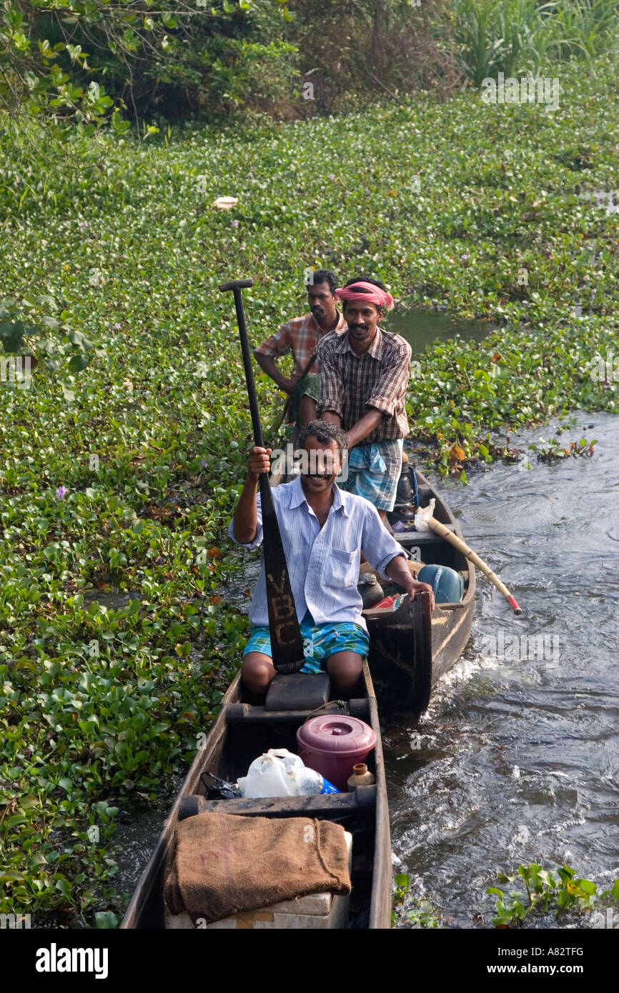 India Kerala backwaters indian people in canoe Stock Photo - Alamy