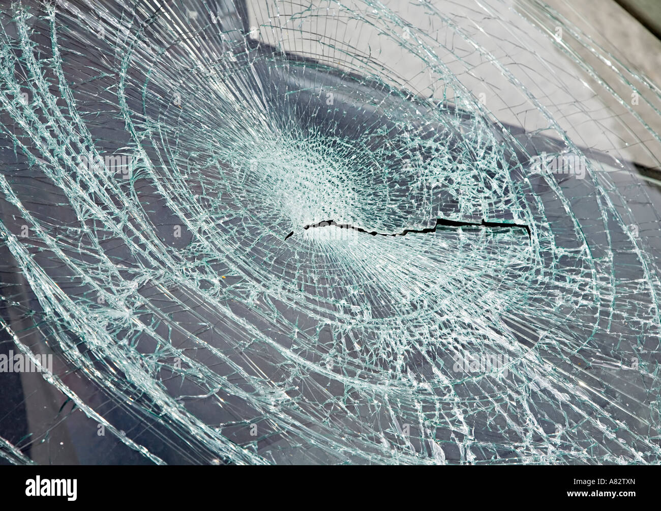 Impact pattern on broken car windscreen Stock Photo - Alamy