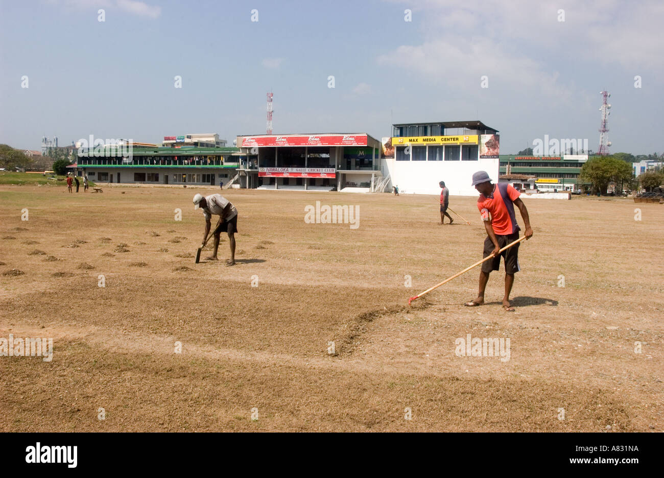 Workers make repairs to surface of pitch after asain tsunami, Galle ...