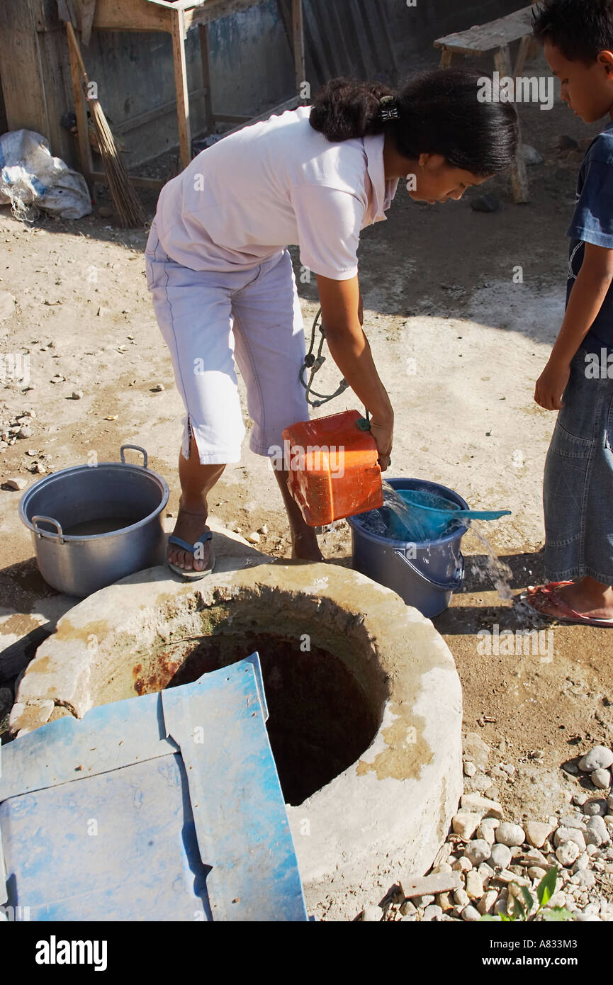 Children collecting water from well hi-res stock photography and images ...