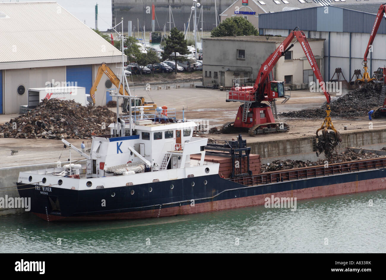 Cargo ship being loaded with scrap metal by grab cranes, Granville ...