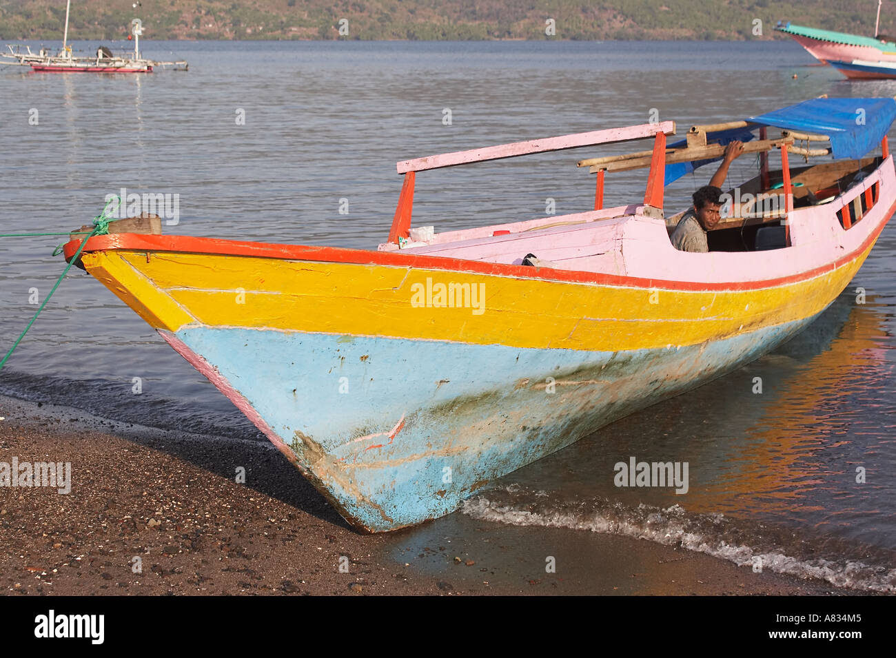 Man Fixing Boat Stock Photo - Alamy