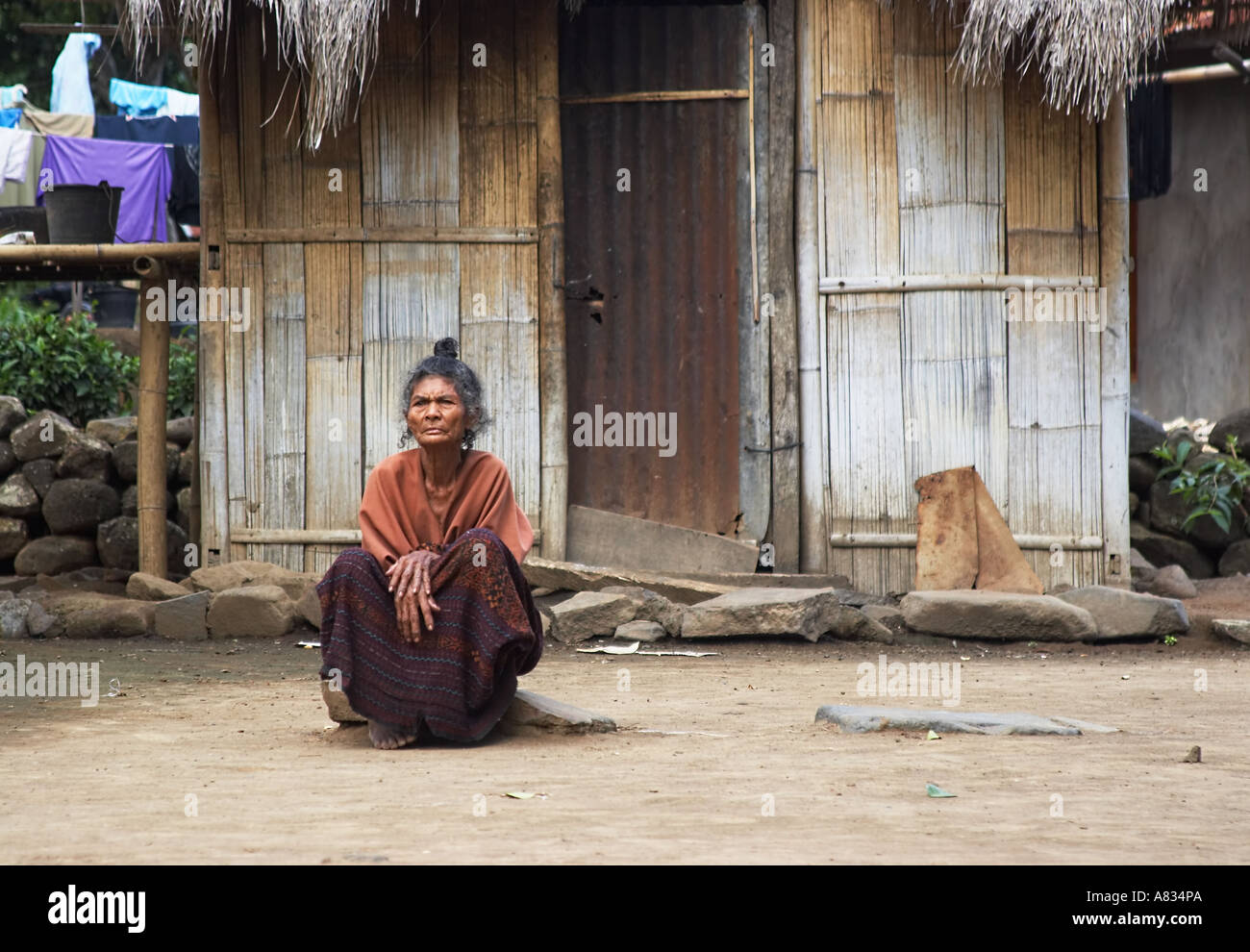 Female sitting at logs of wood hi-res stock photography and images - Alamy
