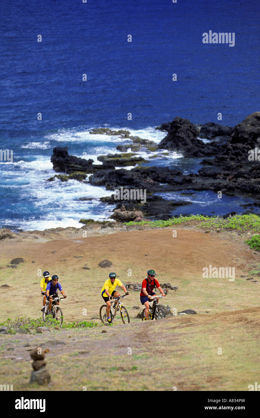 A group mountain biking above the ocean on North Maui, Hawaii Stock ...