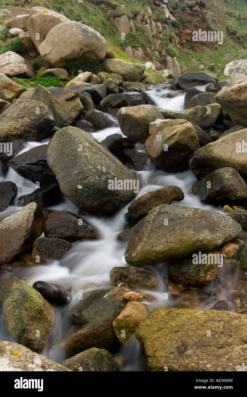 Water flowing between rocks Stock Photo - Alamy