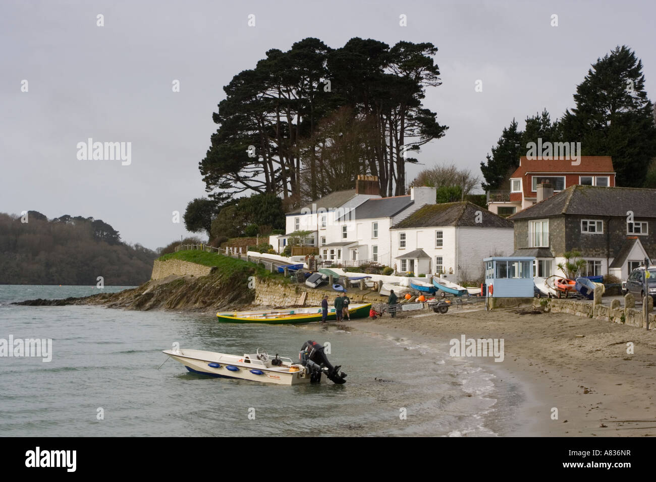 The beach at Helford Passage Cornwall UK with a small boat and Gig ...