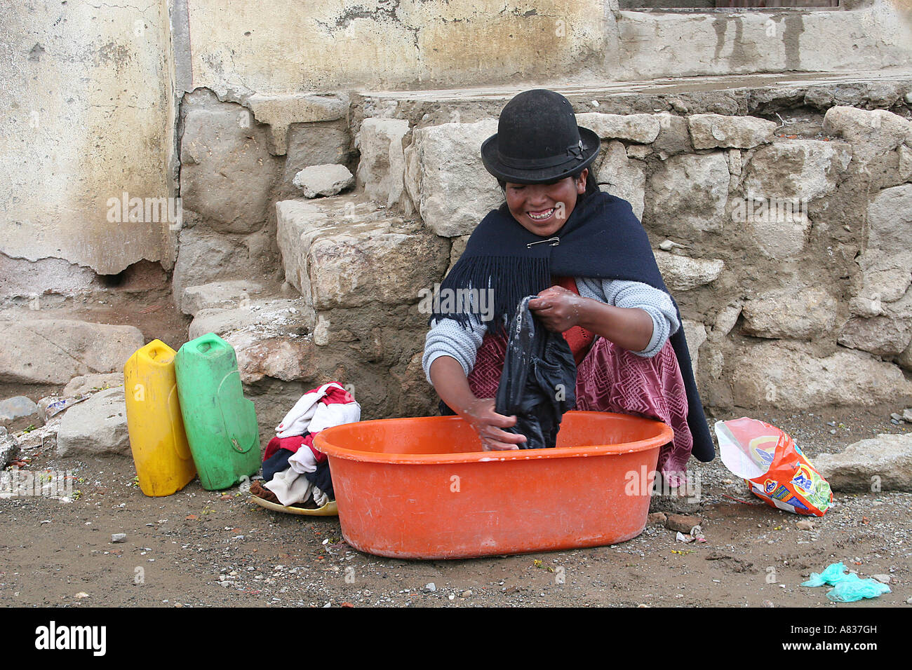 A traditional woman in hat/A miner's wife doing the wash Stock Photo ...