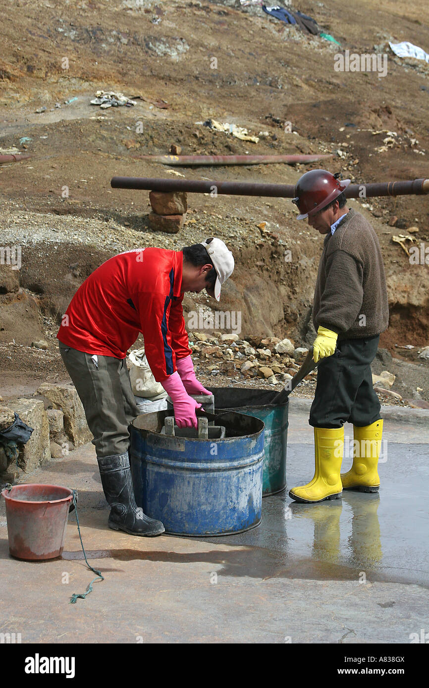 Two miners at work washing tin ore in Siglo Xx, Potosi, Bolivia Stock ...
