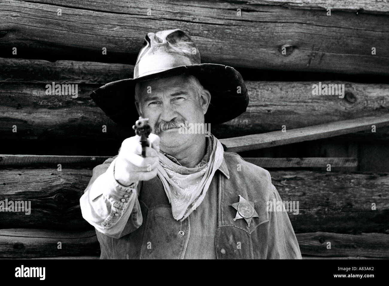 A Sheriff Cowboy reenactor with his gun pointed Stock Photo - Alamy