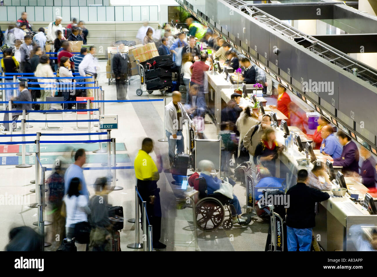 Travelers wait a the ticketing counter in the Tom Bradley International ...