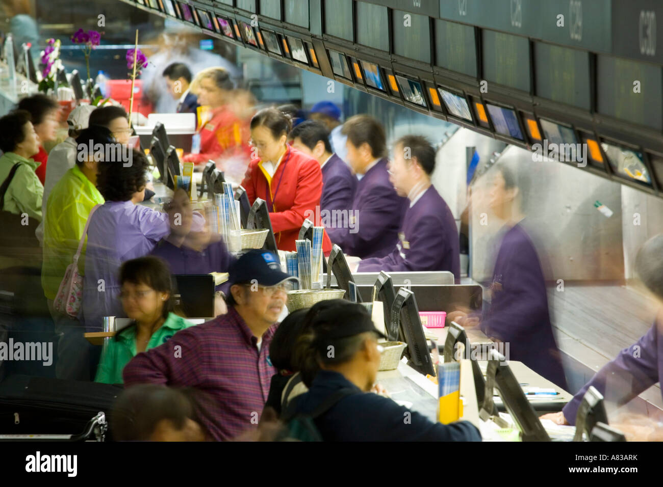 Travelers wait at the ticketing counter in the Tom Bradley terminal at ...